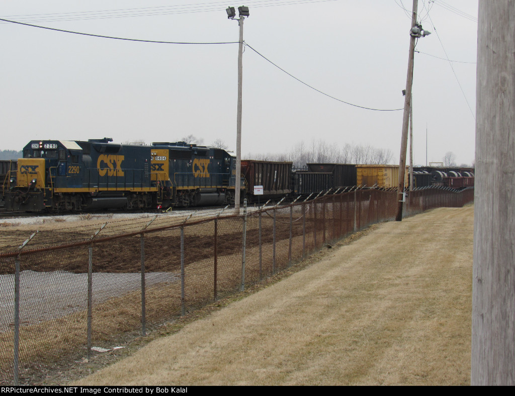 CSX 2290 CSX 6484, now coupled up with another string of cars, sits & waits